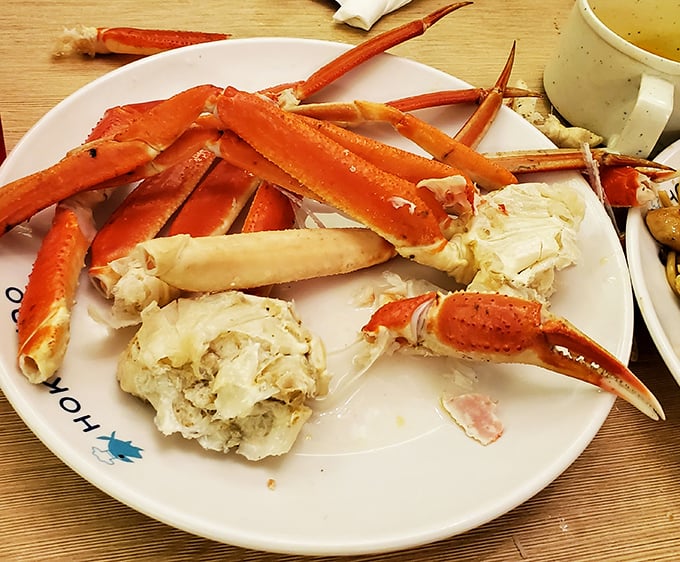 The crown jewel of any seafood buffet – snow crab legs arranged like nature's perfect puzzle, waiting to reveal their sweet treasure.