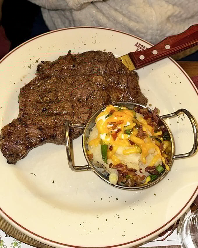 A perfectly charred steak with a loaded baked potato that's practically wearing jewelry. This plate doesn't just satisfy hunger—it fulfills a primal craving.