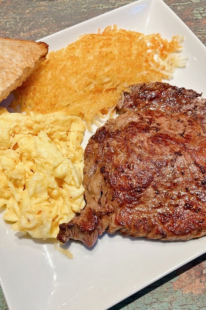 This steak and eggs plate doesn't just break fast—it demolishes hunger. Perfectly seared beef alongside fluffy scrambled eggs and crispy hash browns.