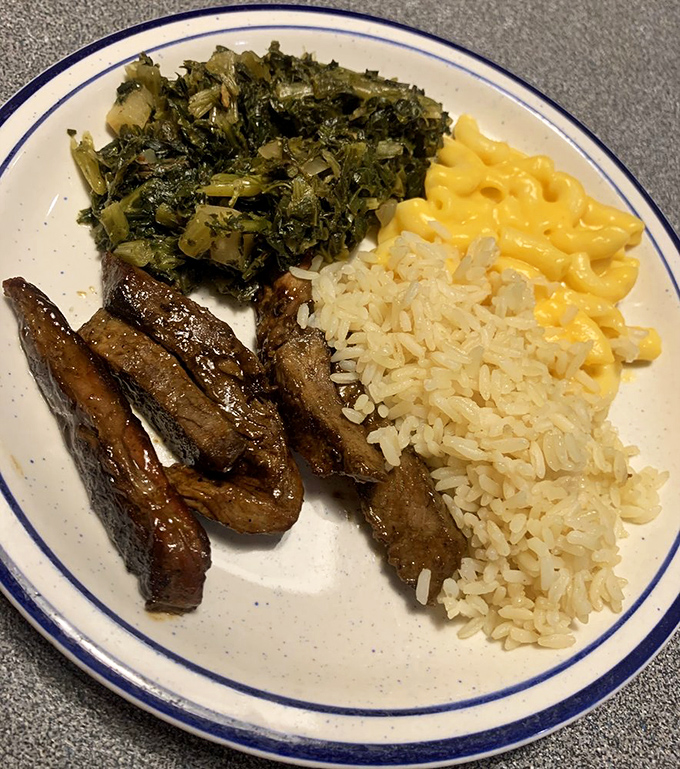 Soul food that actually feeds your soul: tender steak tips, perfectly cooked greens, and rice ready to soak up every last drop of goodness.