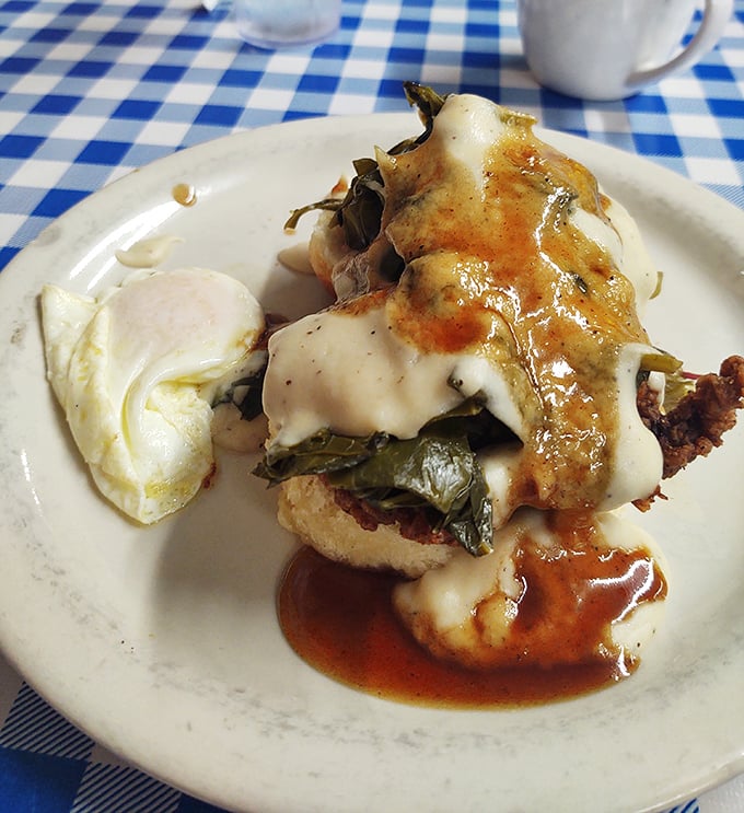 Southern ingenuity on a plate—collard greens, melted cheese, and gravy creating a breakfast symphony that Mozart would envy.