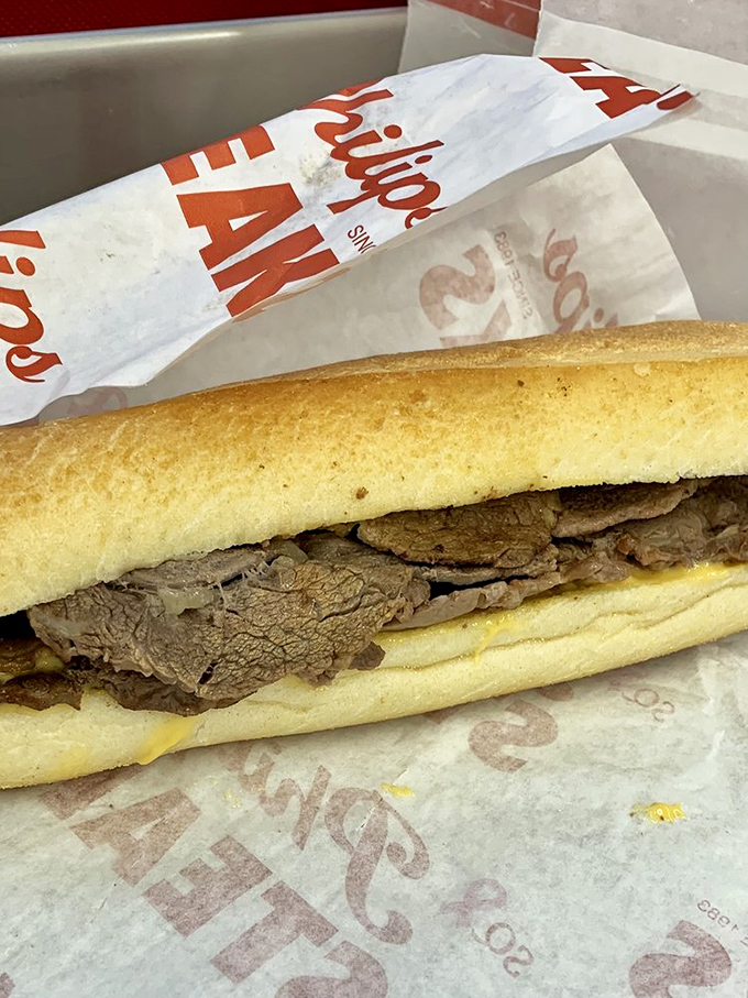 Simplicity at its finest—thinly sliced ribeye tucked into a pillowy roll. No Instagram filter needed when perfection comes wrapped in wax paper.