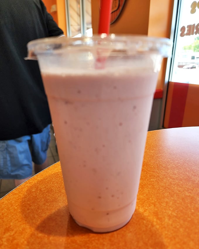 This strawberry milkshake isn't just thick—it's contemplating a career change to become soft-serve. Straw strength will be tested.