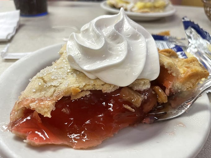 Strawberry pie with a cloud of whipped cream – the kind of dessert that makes you consider starting with the last course first.