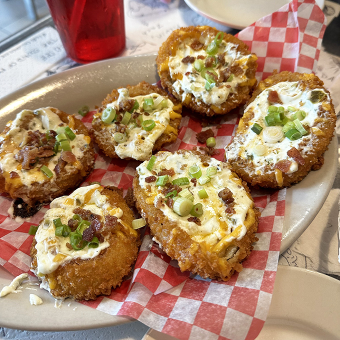 These aren't your average onion rings—they're stuffed with cheesy, bacony goodness that makes sharing them an act of true friendship.