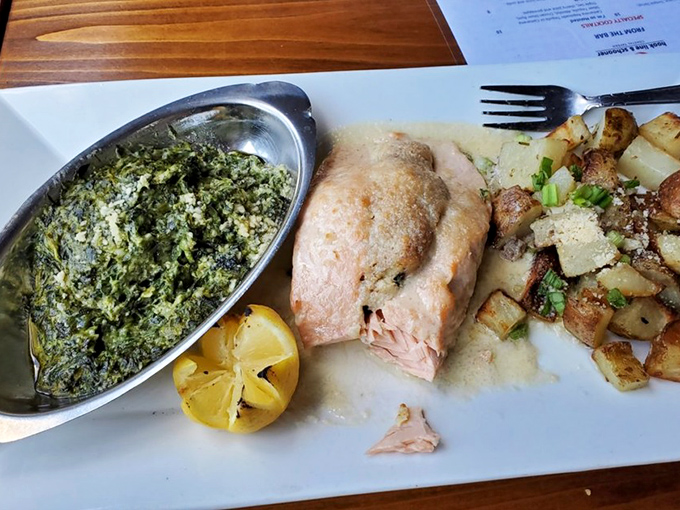 Salmon that didn't just show up to dinner—it dressed for the occasion. That creamed spinach side is no slouch either.