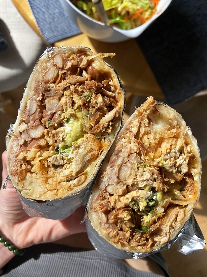 The super chicken burrito, split to reveal its inner glory – like finding out your mild-mannered friend is secretly a superhero.