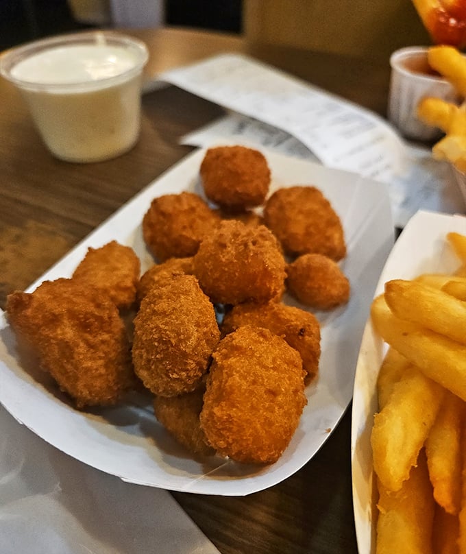 Golden-brown nuggets of happiness that crunch like childhood memories. These aren't just tater tots—they're edible nostalgia.