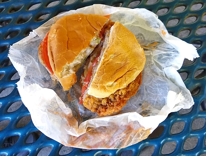 This tenderloin sandwich has clearly never heard the phrase "stay within your bun boundaries"—a delicious protest against portion control.