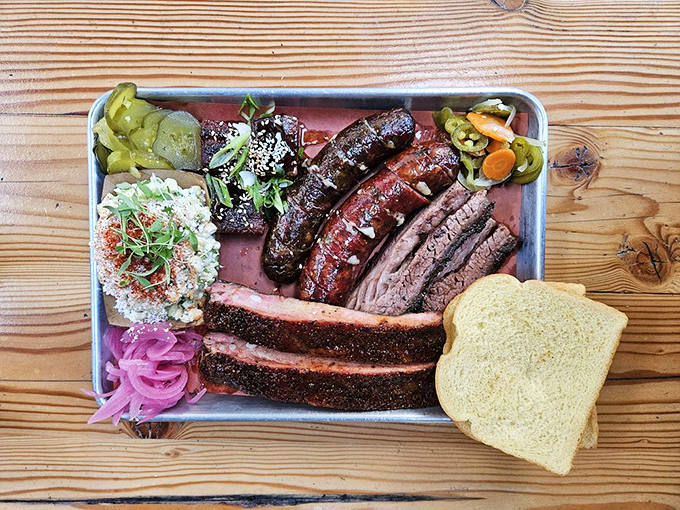 This Texas-style tray is what happens when smoke meets meat meets destiny. The pickled onions aren't just garnish—they're essential counterpoints.