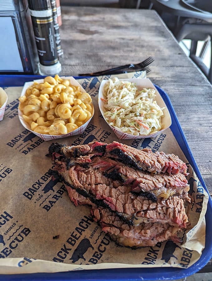 Texas-style brisket with that telltale pink smoke ring and bark that would make a tree jealous. Meat candy for grown-ups.