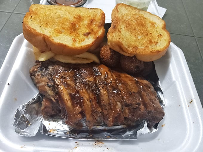 Ribs wrapped in foil like the precious gift they are. That Texas toast isn't just bread—it's an edible napkin waiting for its moment.
