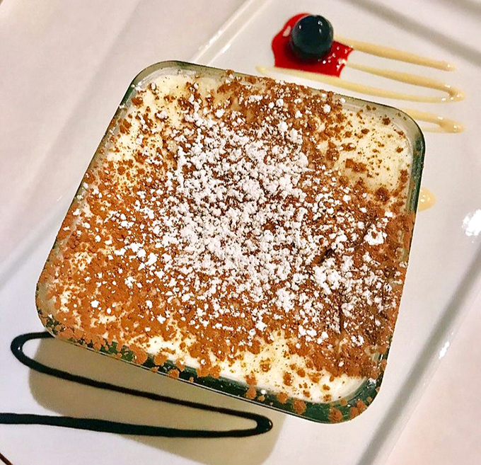 This tiramisu isn't just dessert—it's therapy in a square dish. The dusting of cocoa powder is like a warm Italian sunset over creamy mascarpone hills.