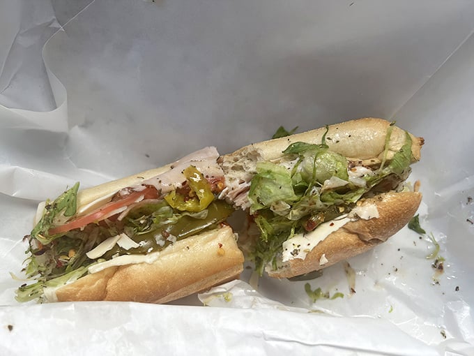 Simple pleasures done right – this unassuming sandwich proves that greatness doesn't need fancy ingredients, just respect for tradition.
