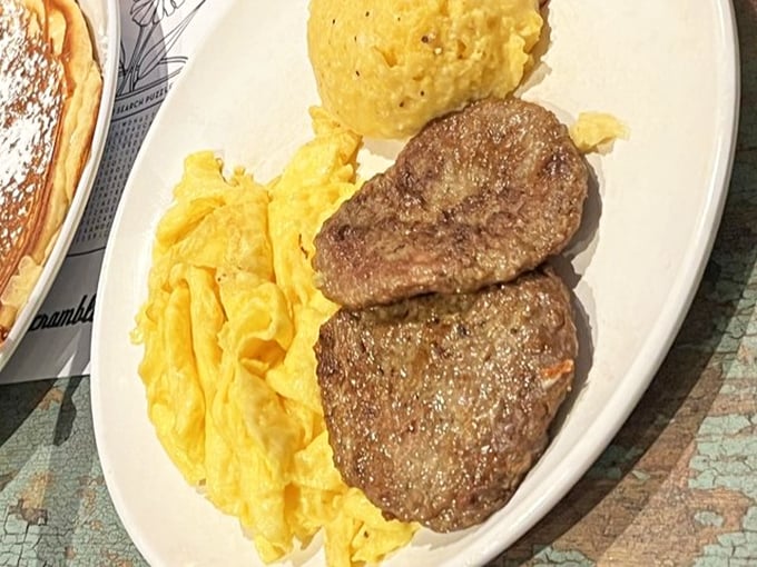 Sausage patties and scrambled eggs—a breakfast classic that proves sometimes the simplest combinations deliver the most profound satisfaction.