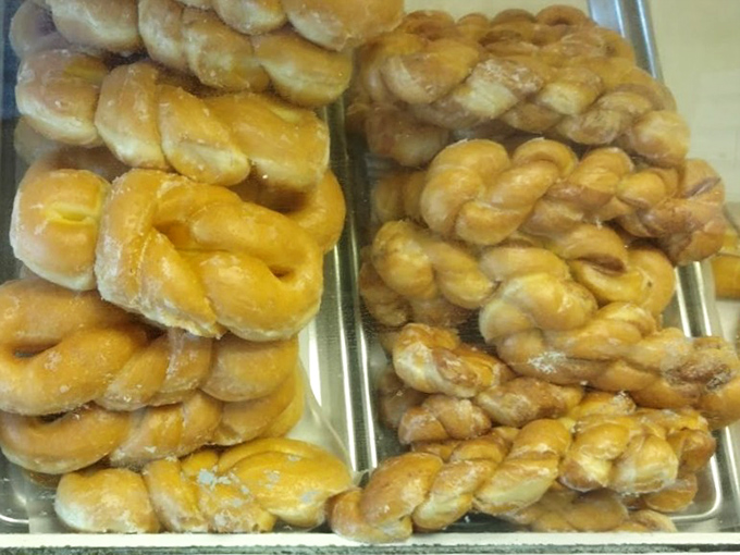 These twisted donuts aren't having an identity crisis—they're just showing off their golden curves like Renaissance sculptures made of dough.