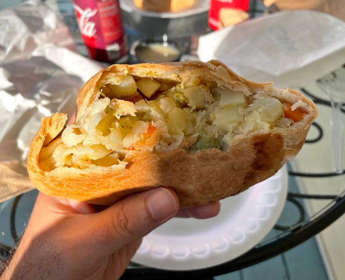 The veggie pasty reveals its colorful interior – a mosaic of potatoes, carrots and other vegetables tucked inside that perfect pastry pocket. Even meat-lovers might be converted.