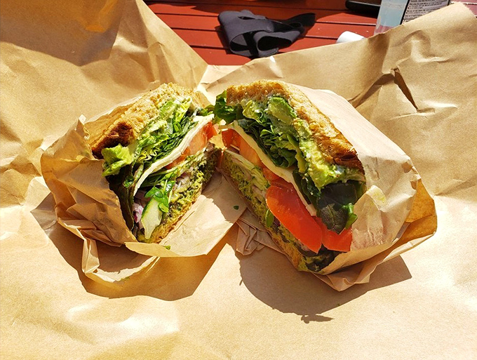 Proof that vegetarian options needn't be an afterthought—this vibrant veggie sandwich bursts with color and crunch between perfectly toasted bread.