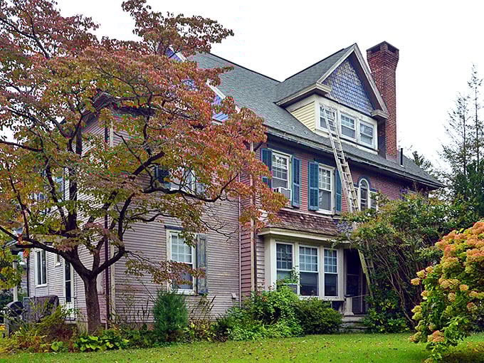 Fall foliage frames this Victorian beauty like nature's own Instagram filter—a reminder that some homes are meant to be admired, not just lived in.