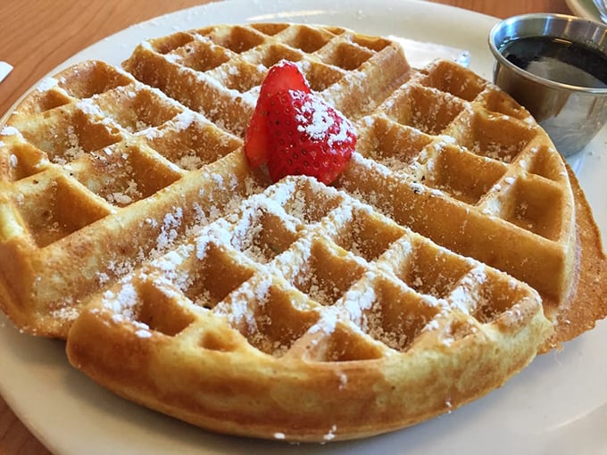 Golden waffles with perfect squares for syrup pooling – because geometry matters when breakfast is this serious.