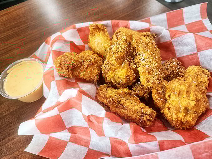 Golden-brown chicken tenders that shatter with each bite, served with a dipping sauce that's their perfect dance partner. Crispy on the outside, juicy within – nature's perfect design.