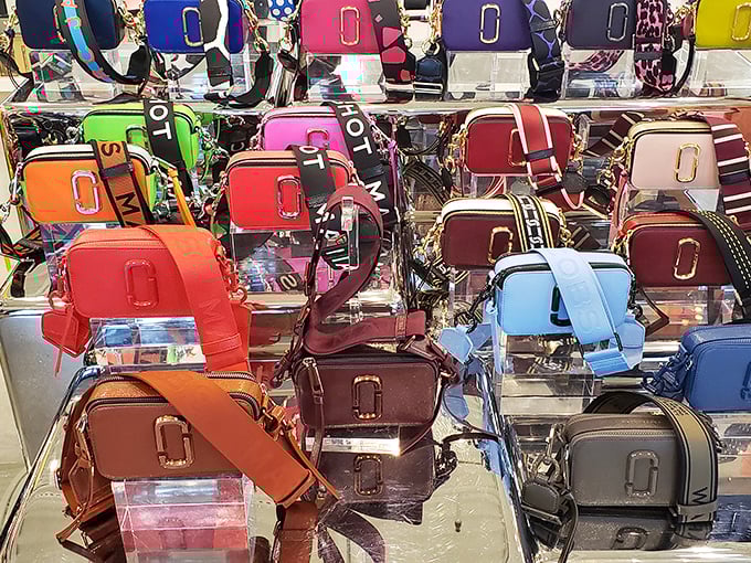 A rainbow of designer crossbodies – proof that good things come in small packages, especially when they're sporting logos that make your friends jealous.