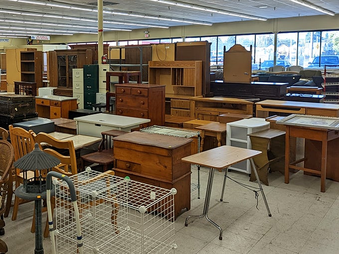 A furniture forest of solid wood desks, dressers, and tables—each piece patiently waiting for its "forever home" moment.