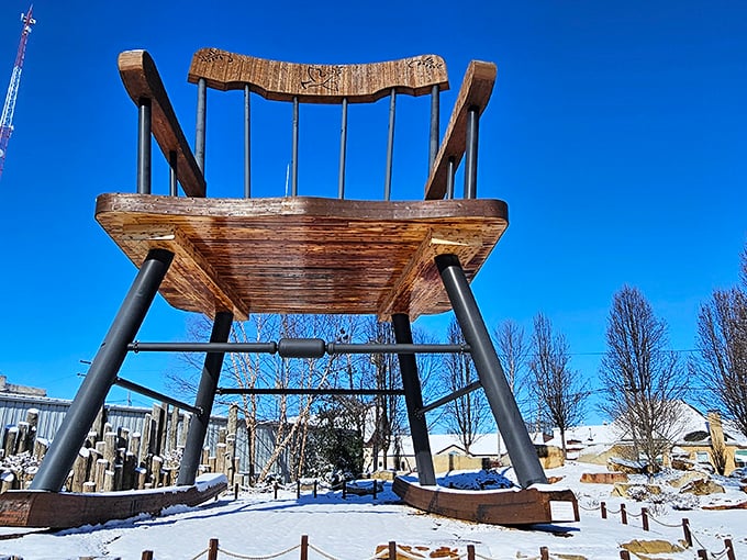 Winter transforms the World's Largest Rocking Chair into what looks like a prop from "Frozen: Giant's Edition."