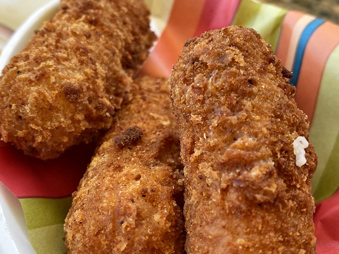 Golden-brown yuca cheese sticks that make regular mozzarella sticks seem like they're not even trying—crunchy outside, molten inside, and utterly irresistible.
