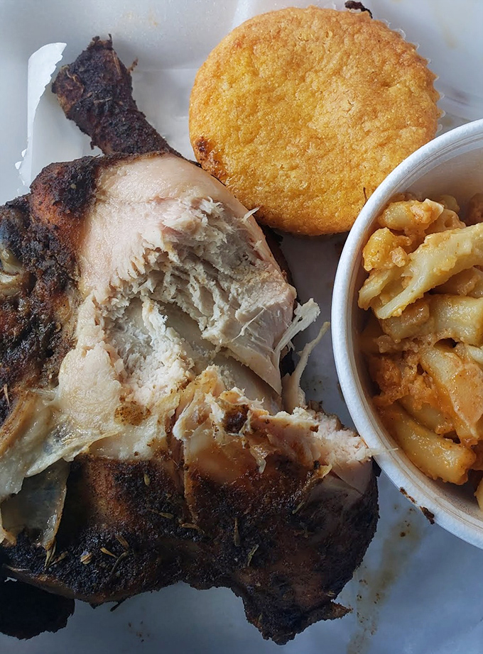 This isn't just chicken—it's a masterclass in tenderness, with meat that practically serenades you as it falls off the bone beside that golden cornbread.
