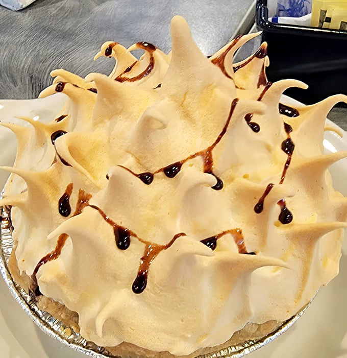 Behold the meringue peaks that would make the Matterhorn jealous. This isn't dessert—it's architecture with a sweet tooth.