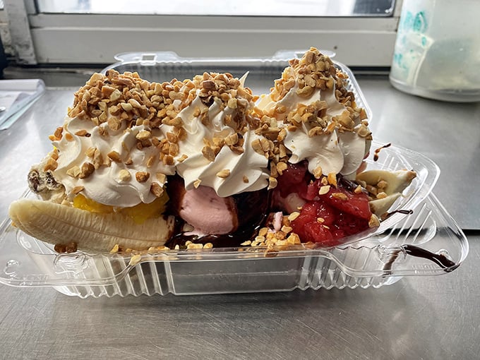 This banana split isn't just dessert, it's architecture—a magnificent construction of fruit, ice cream, and toppings that demands to be photographed before demolished.