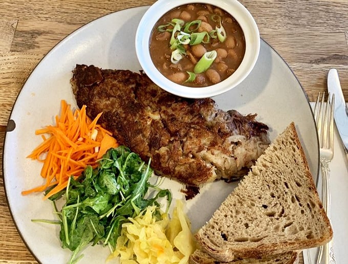 When breakfast meets lunch and they fall madly in love – a hearty plate featuring perfectly seasoned hash, fresh vegetables, and bread substantial enough to sop up every last morsel.