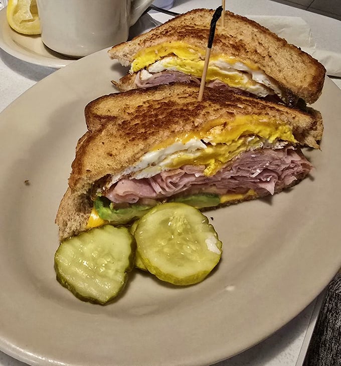 The breakfast sandwich that launched a thousand food comas—layers of ham, egg, and cheese creating the morning trilogy your taste buds deserve.