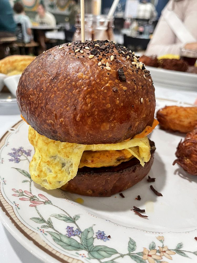 This breakfast sandwich doesn't just break the fast – it demolishes it with perfectly melted cheese, eggs, and a bun that deserves its own fan club. 
