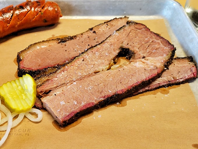 Sliced brisket with the perfect pink smoke ring – proof that patience isn't just a virtue, it's a requirement for barbecue greatness.