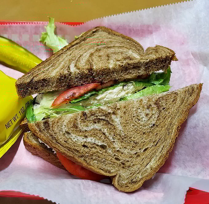 Marble rye embraces fresh veggies and what appears to be chicken salad—a sandwich that wouldn't be out of place in a New York deli.