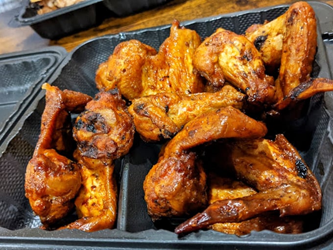 Chicken wings with a golden-brown tan that would make any beach-goer jealous. These aren't just wings—they're flavor delivery vehicles.