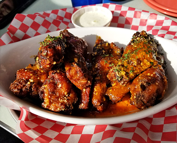 Wings so perfectly sauced they should come with their own theme music. Napkins required, regrets impossible.