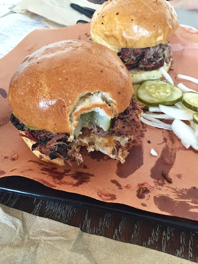 Not just a sandwich but an architectural marvel—the way that bun struggles heroically to contain its smoky treasure deserves an award.