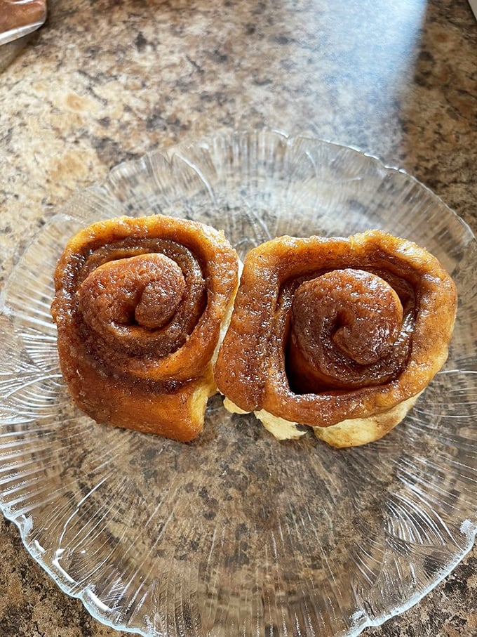 Cinnamon rolls with that perfect spiral – like edible hypnosis trying to convince you that calories don't count on vacation. Spoiler alert: they don't.