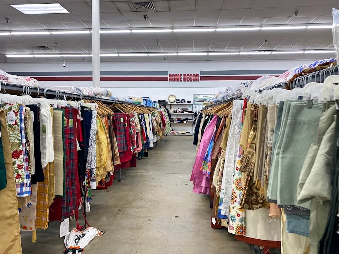 The fabric time machine – where vintage tablecloths and curtains hang like colorful ghosts of home décor past.