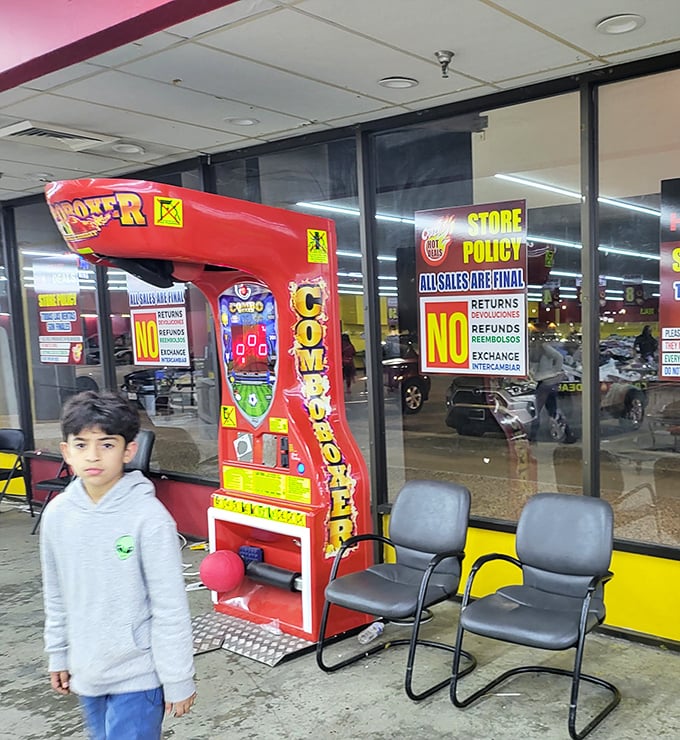 Even kids get entertainment while parents hunt—this boxer arcade game offering a momentary distraction from the treasure quest.