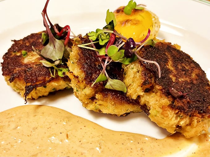 These crab cakes are what other crab cakes dream of becoming—mostly crab, barely bound, with a golden crust that gives way to sweet, delicate meat.