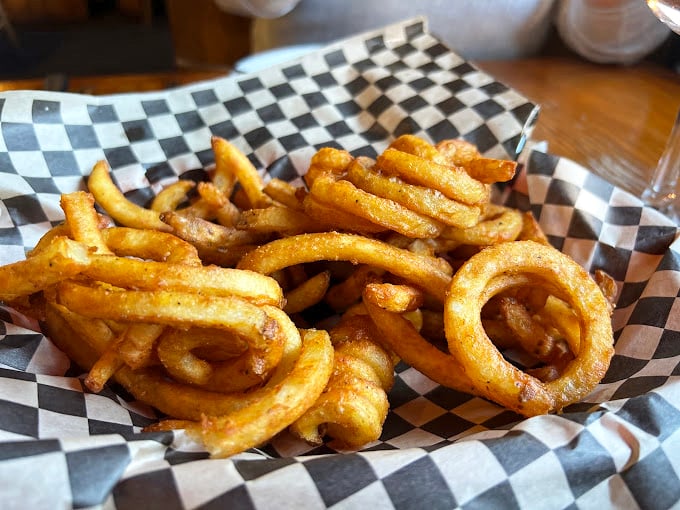 Curly fries that spiral into crispy perfection. These aren't just side dishes—they're supporting actors that steal scenes in your meal's delicious drama.