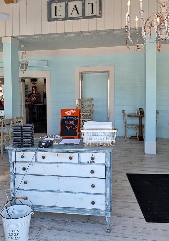 That "EAT" sign isn't just decoration—it's the most straightforward good advice you'll get all day. The distressed dresser adds charm that HGTV hosts would approve of.