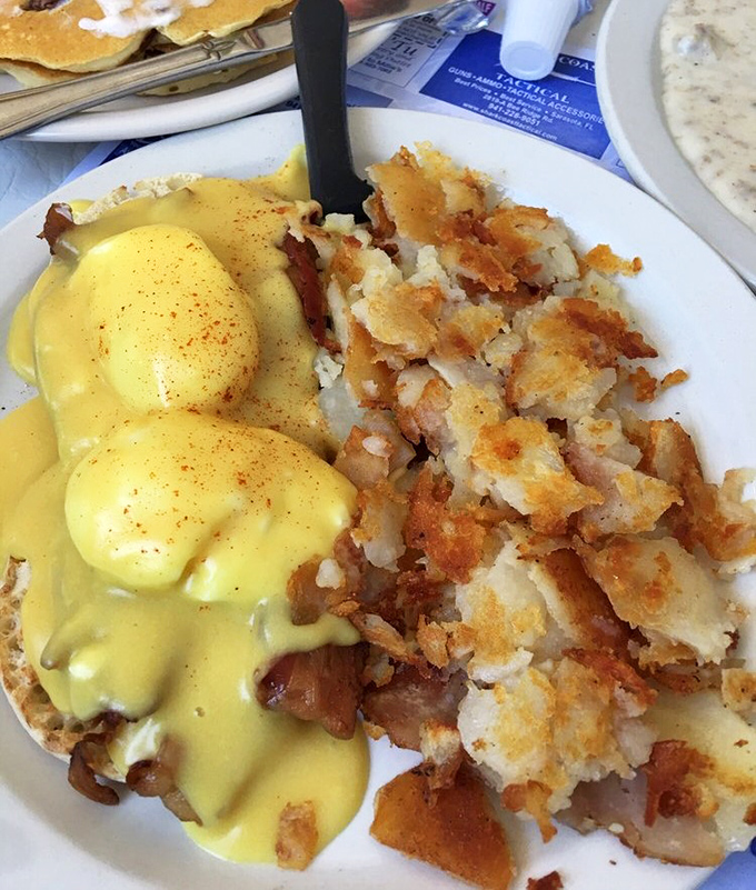Eggs Benedict that would make the Pope jealous—perfectly poached eggs under a hollandaise waterfall with hash browns crispy enough to make you weep.