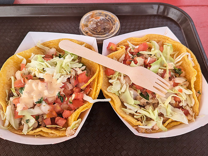 Fish tacos done right – no fusion confusion, just fresh fish wrapped in corn tortilla simplicity.