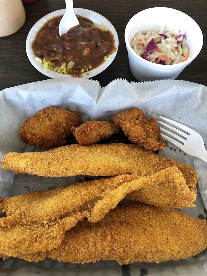 The star of the show: perfectly seasoned catfish with a golden cornmeal crust that shatters with each heavenly bite.