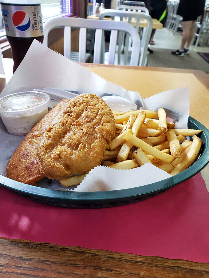 Golden-fried fish and crispy fries—the dynamic duo of comfort food. Neptune himself would trade his trident for this perfectly crisp catch.